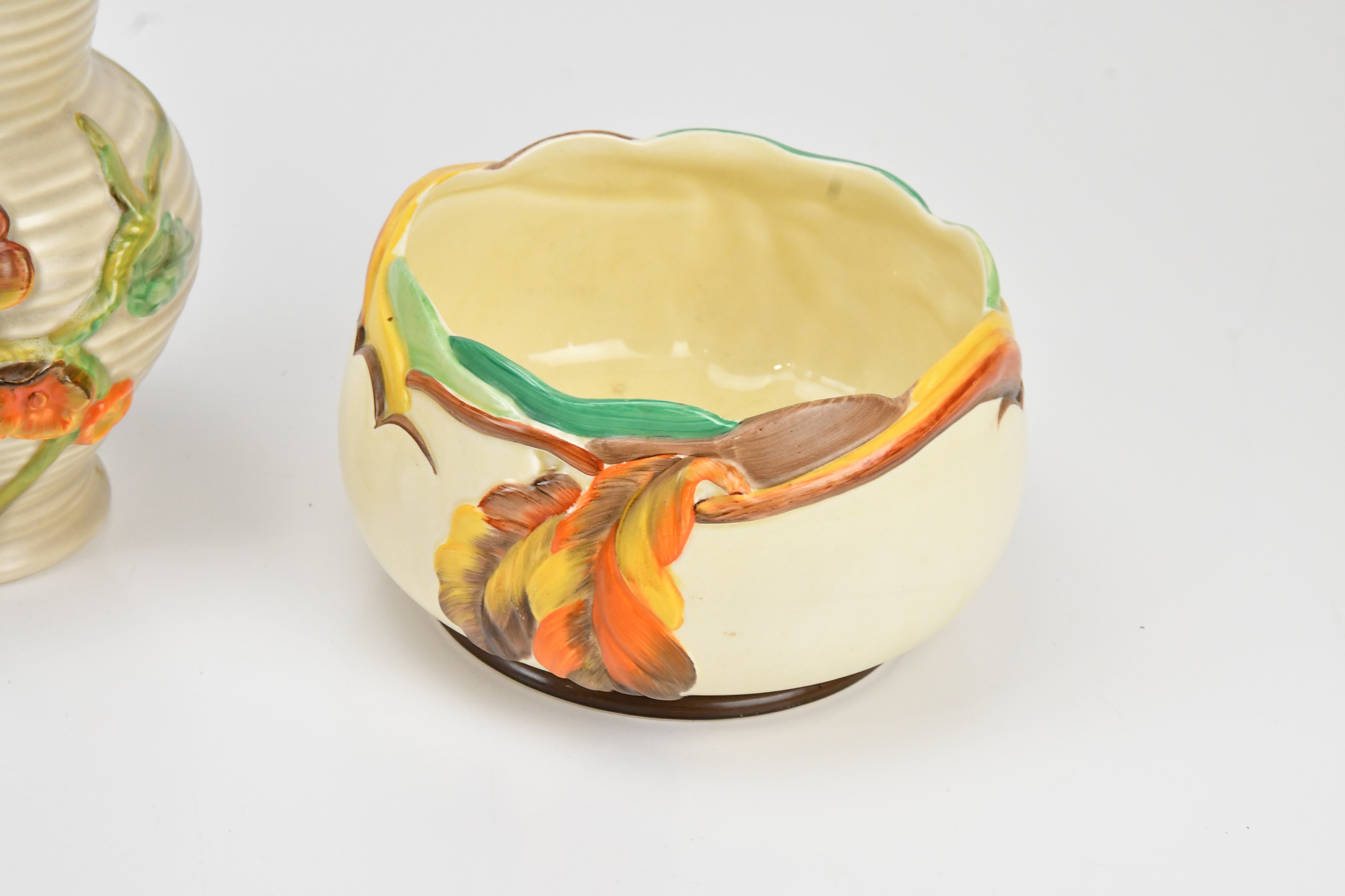 Lot 1500 - CLARICE CLIFF; a hand painted cylindrical